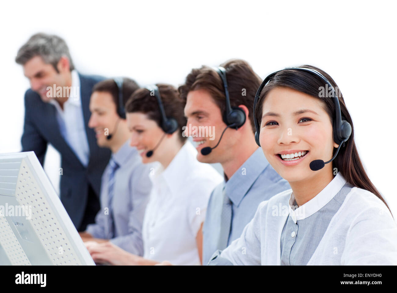 Positive business team talking on headset in a call center Stock Photo ...
