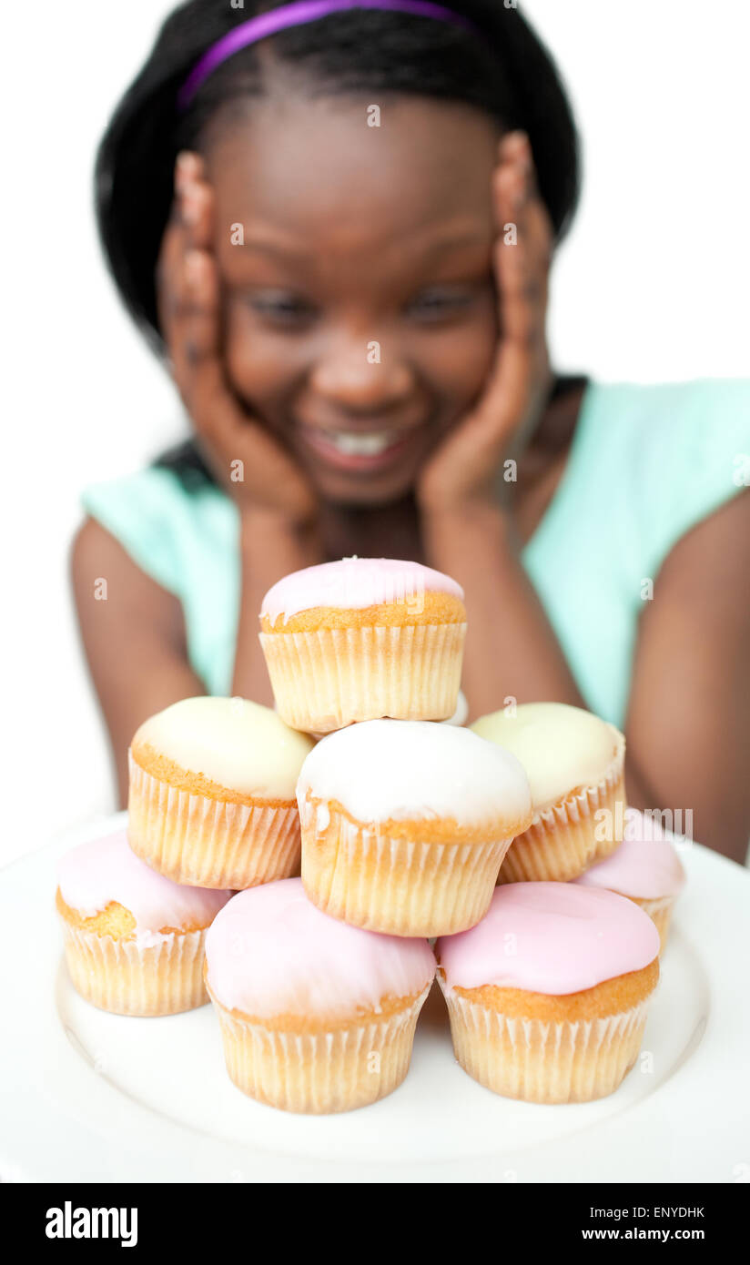 Jolly young woman looking at cakes Stock Photo - Alamy