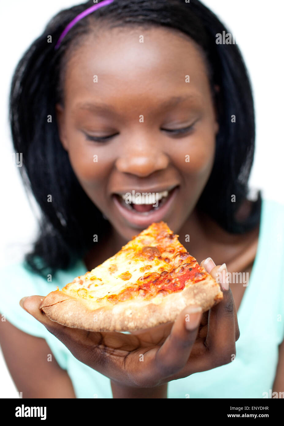Happy woman eating a pizza Stock Photo - Alamy