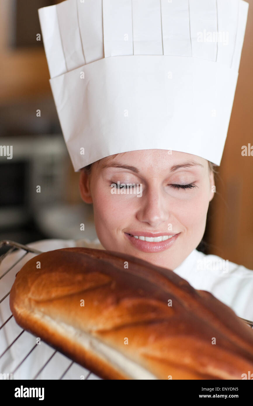 Bright female chef baking bread Stock Photo - Alamy
