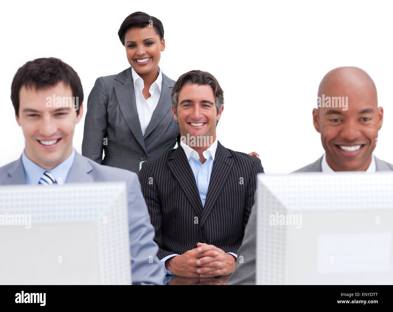 Cheerful business people working at computers in the office Stock Photo ...