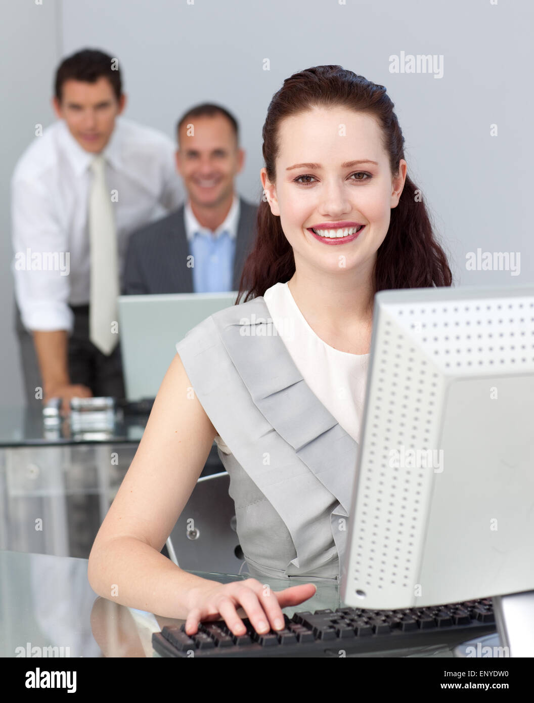 Business co-workers smiling at the camera Stock Photo - Alamy