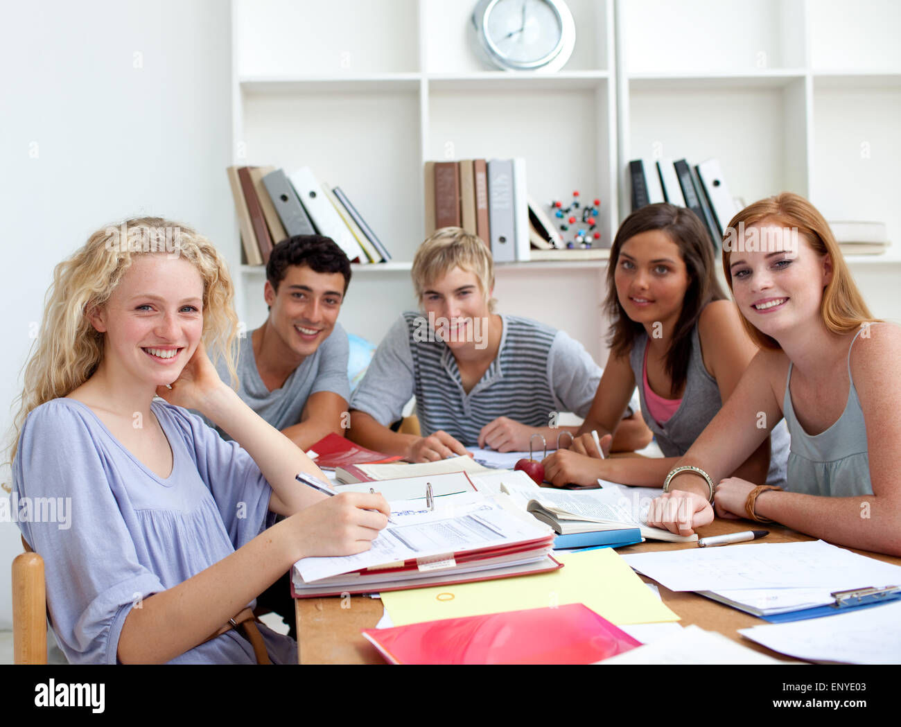 Teenagers doing homework in the library Stock Photo - Alamy