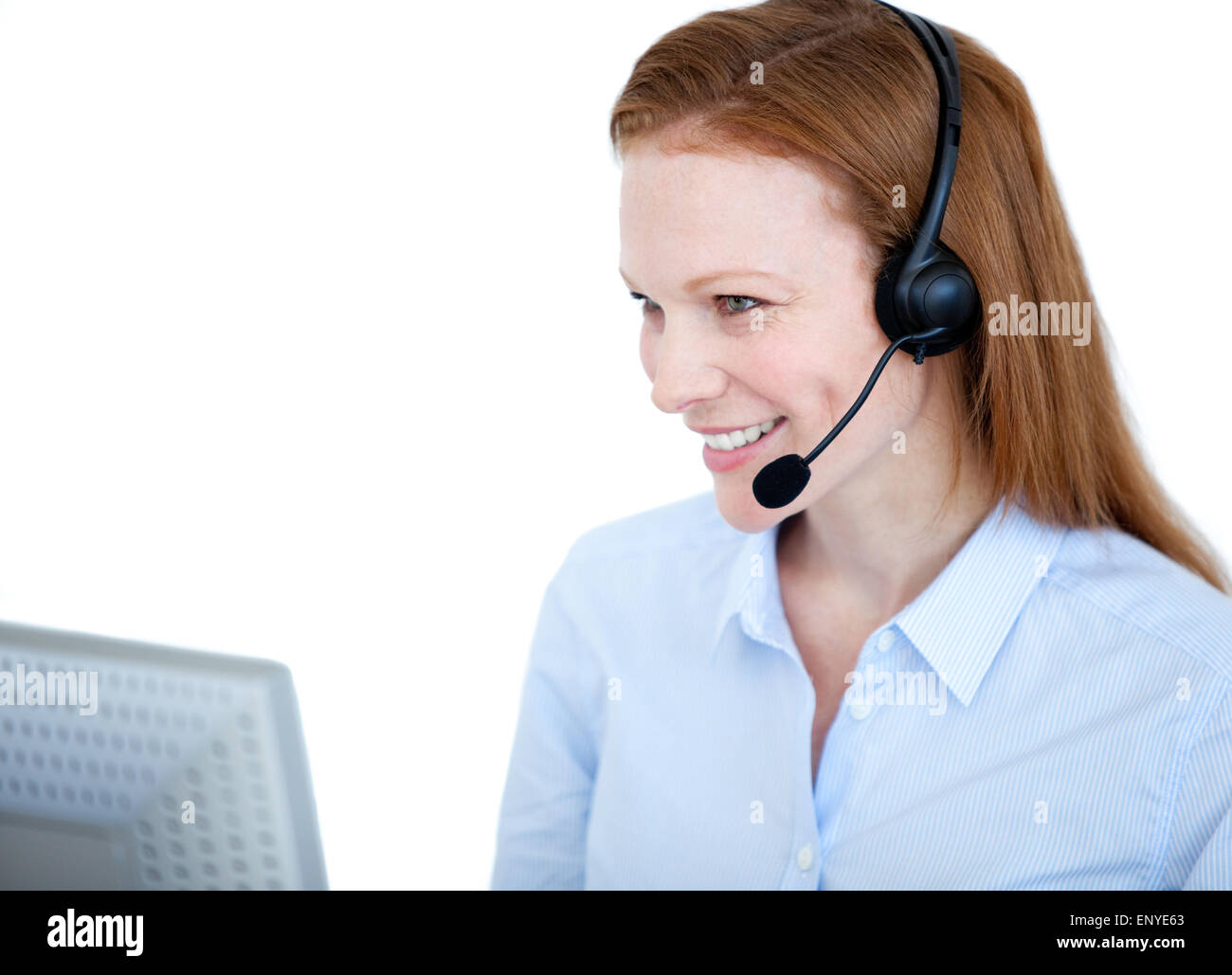 Radiant sales representative woman working on a computer against white ...