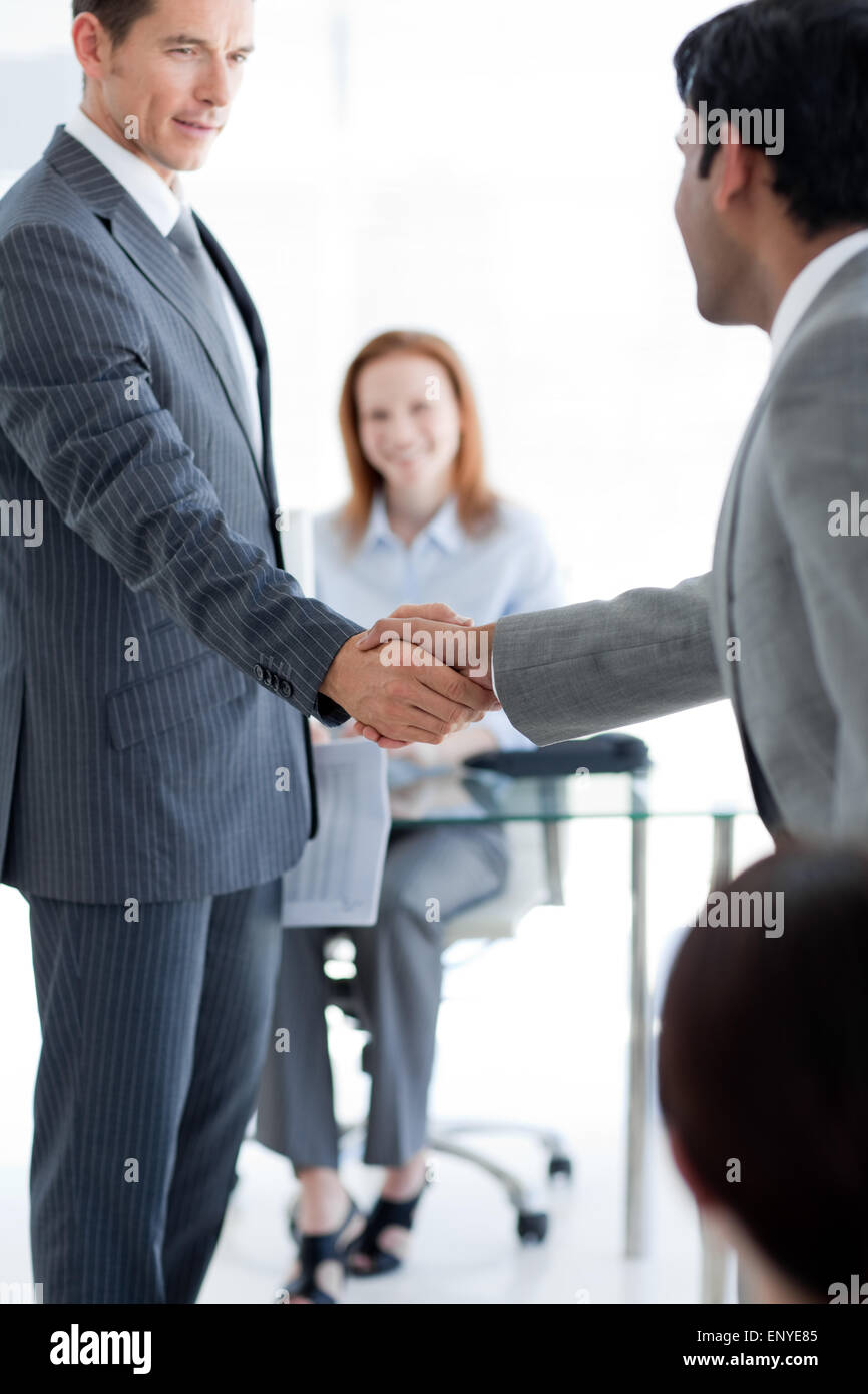 Businessmen greeting each other at a job interview Stock Photo - Alamy