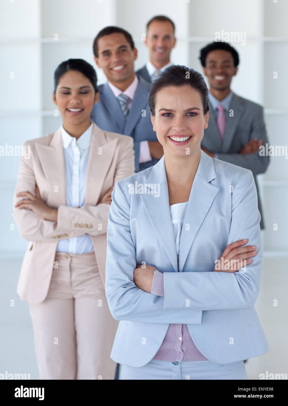 Businesswoman with her team smiling at the camera Stock Photo - Alamy