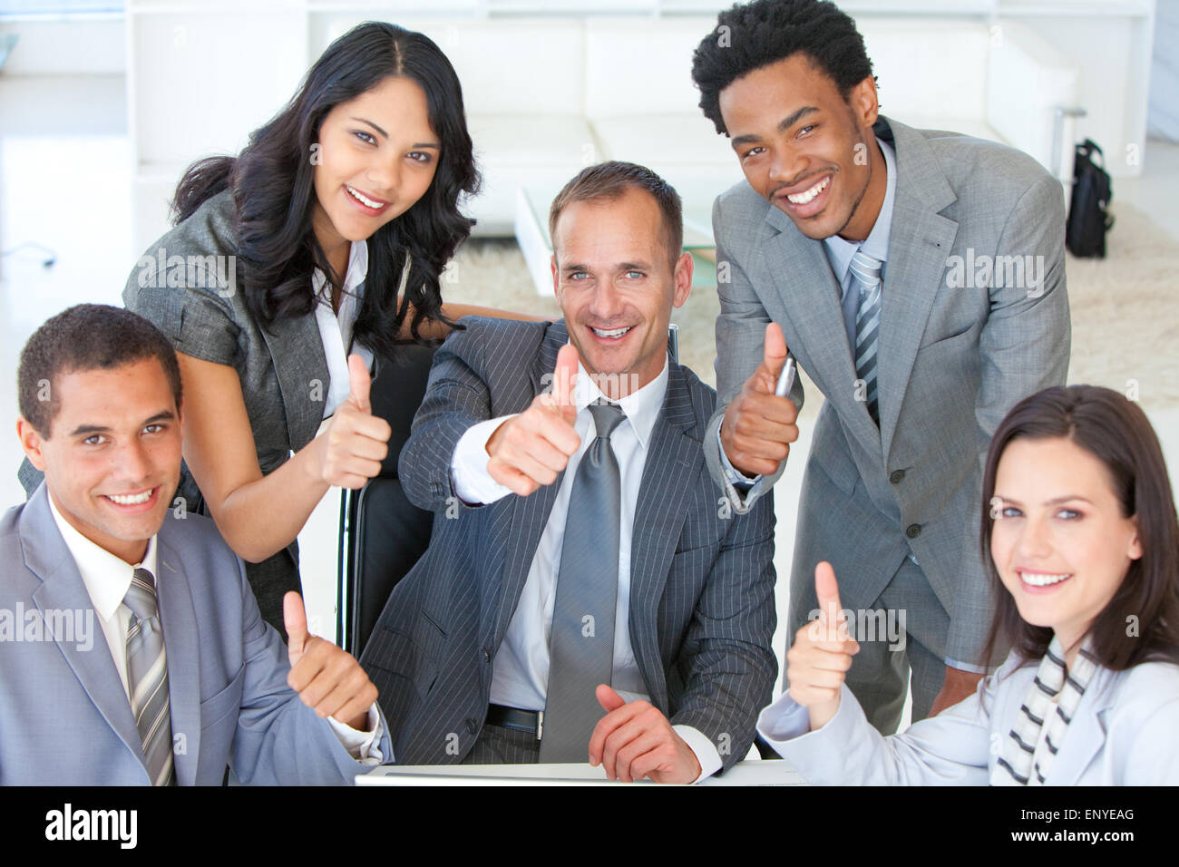 Business team with thumbs up in office Stock Photo - Alamy