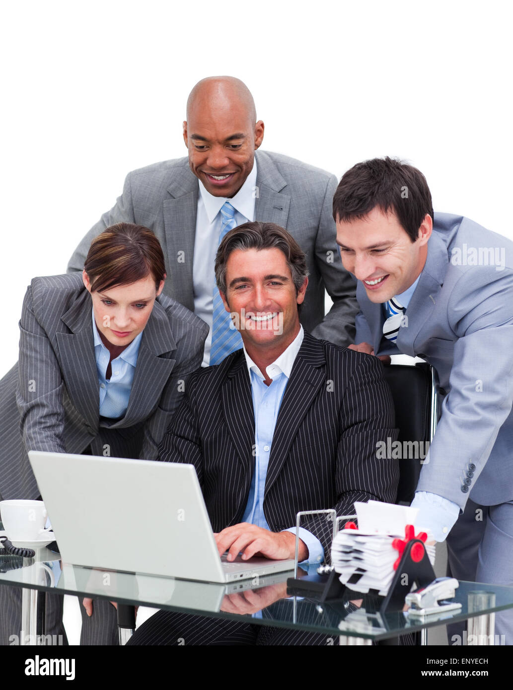 United business team working at a computer against a white background ...