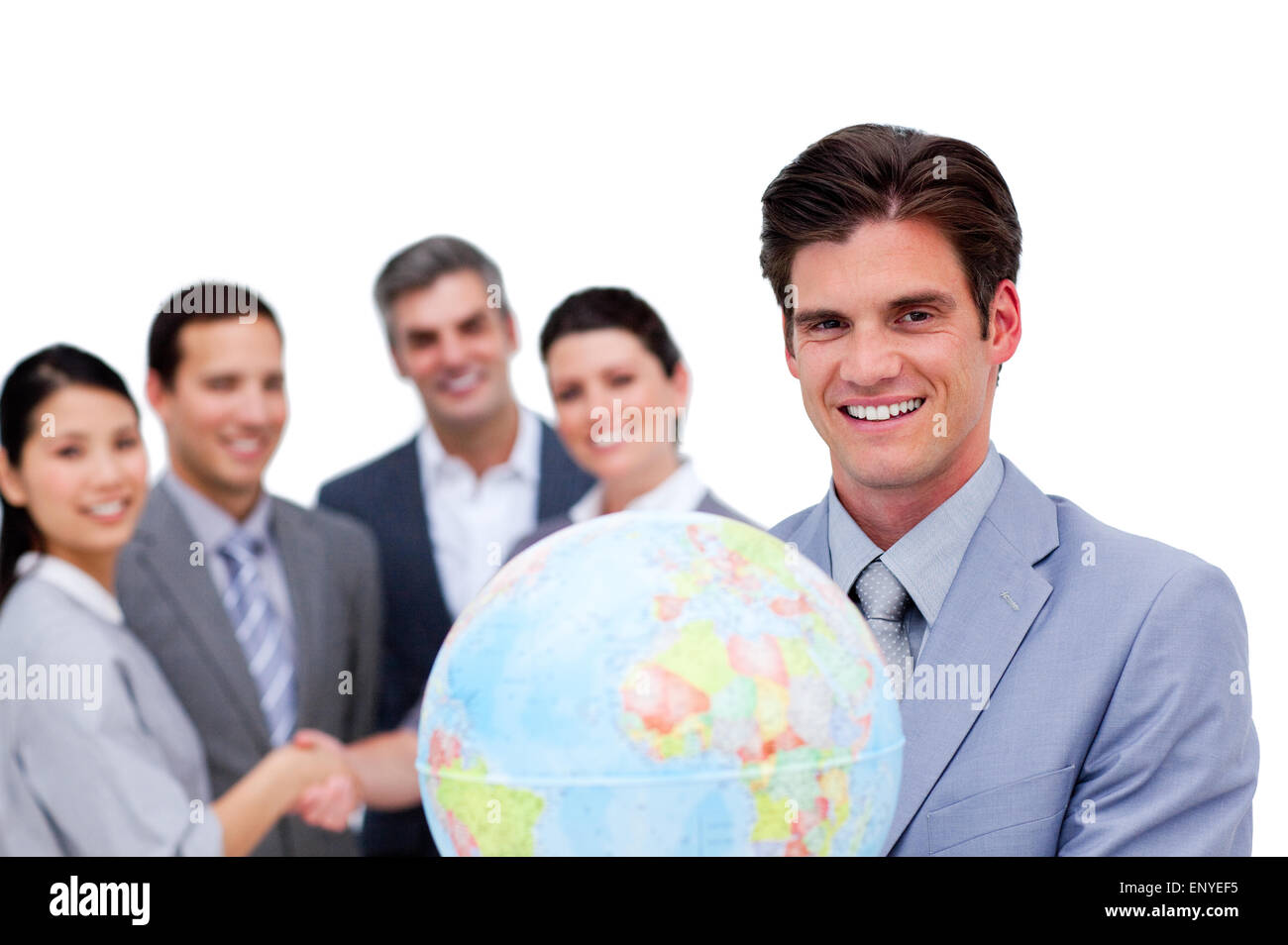 Successful manager and his team holding a terrestrial globe against a ...