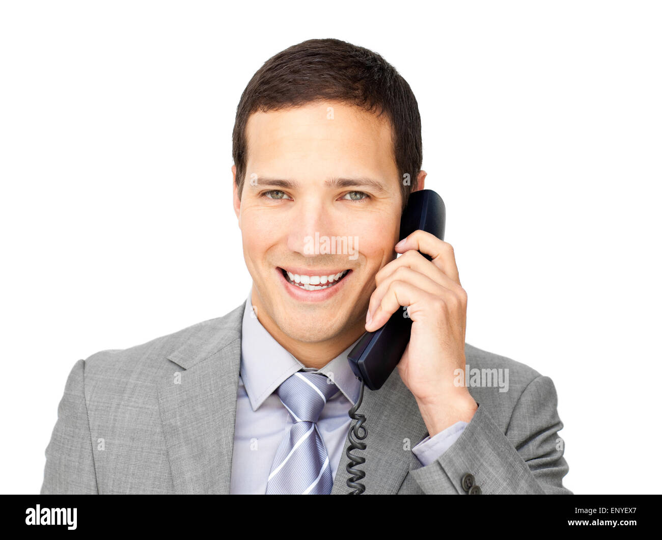 Smiling businessman on phone against a white background Stock Photo - Alamy