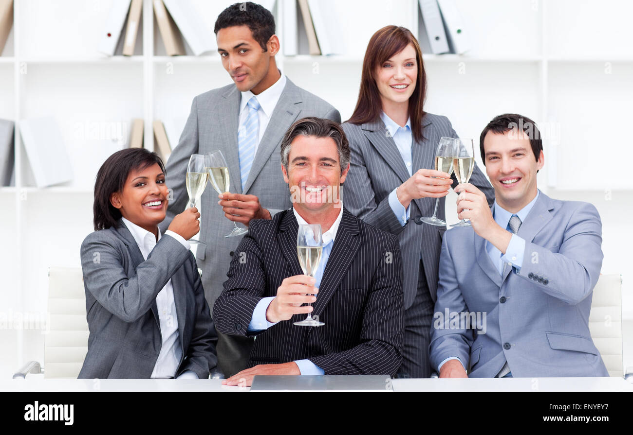 Positive business people toasting with Champagne Stock Photo - Alamy