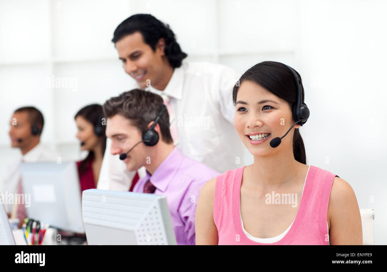 Concentrated business people with headset on Stock Photo - Alamy