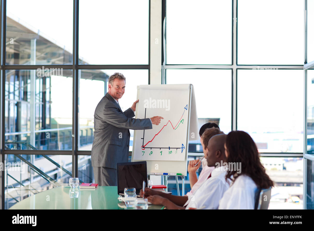 Confident male manager explaining new hi-res stock photography and ...