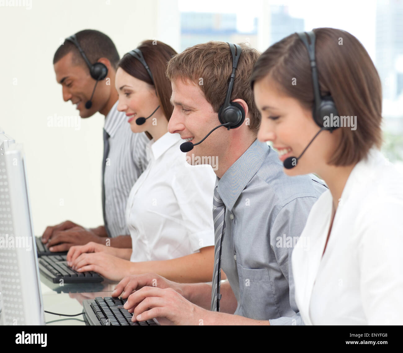 Concentrated customer service agents working in a call center Stock ...