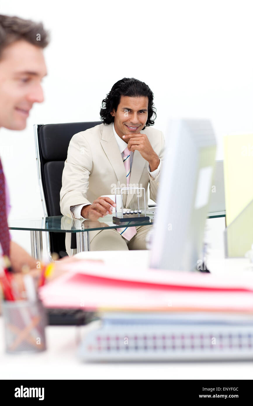 Two smiling businessmen working in the office Stock Photo - Alamy