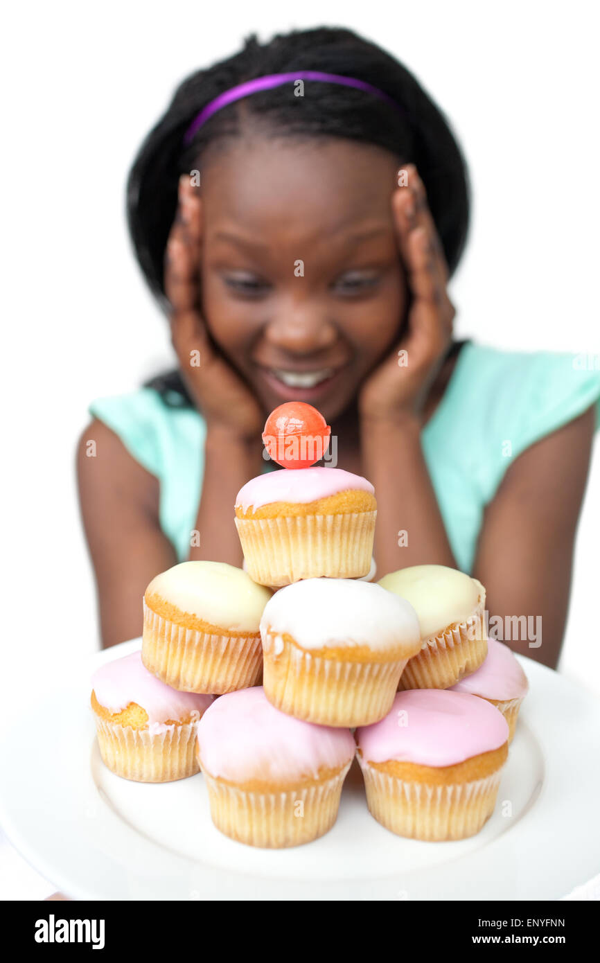 Surprised young woman looking at cakes Stock Photo - Alamy