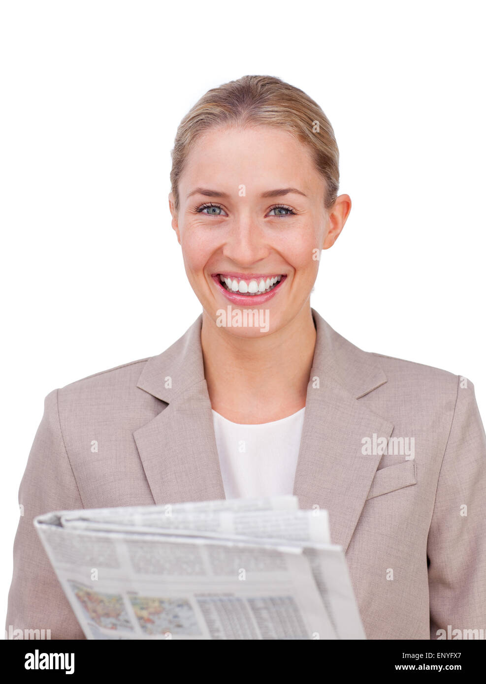 Laughing businesswoman reading a newspaper against a white background ...