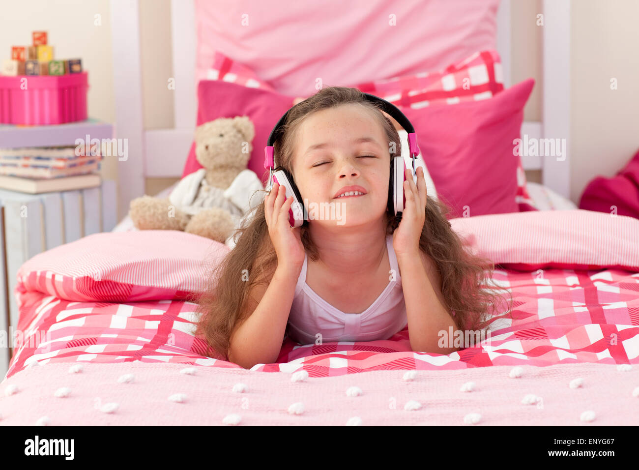 Cute girl listening music with headphones Stock Photo - Alamy