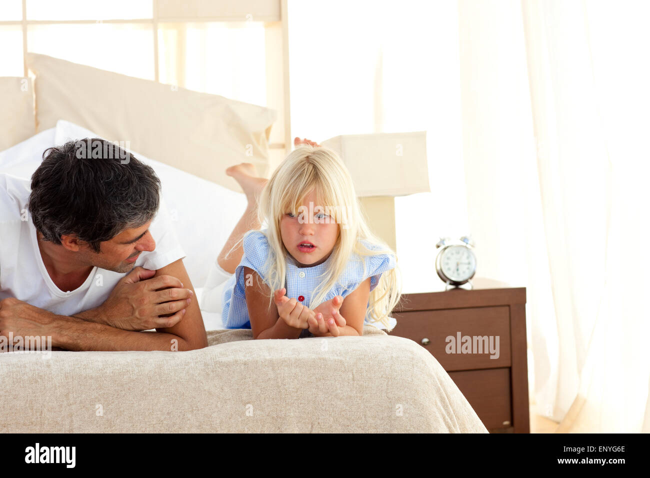 Attentive father talking with his daughter Stock Photo - Alamy