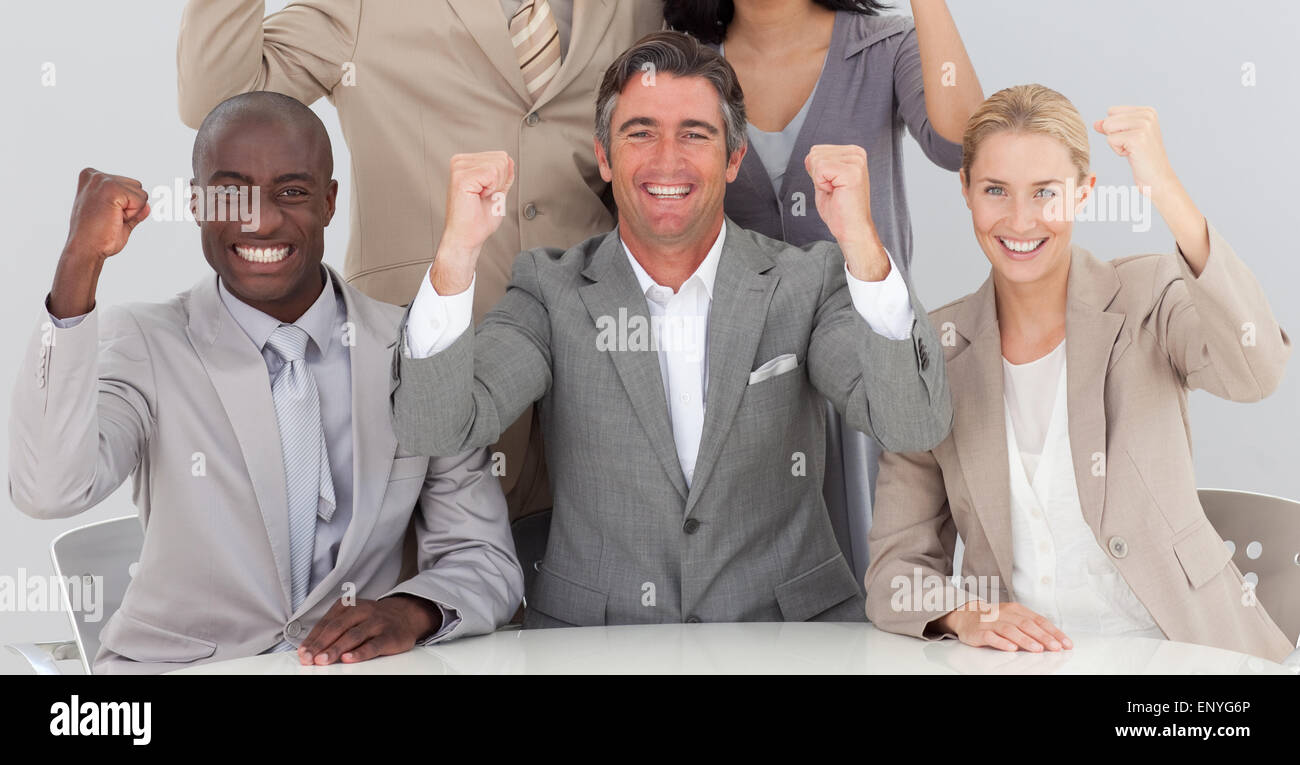 Happy business team celebrating a success Stock Photo - Alamy