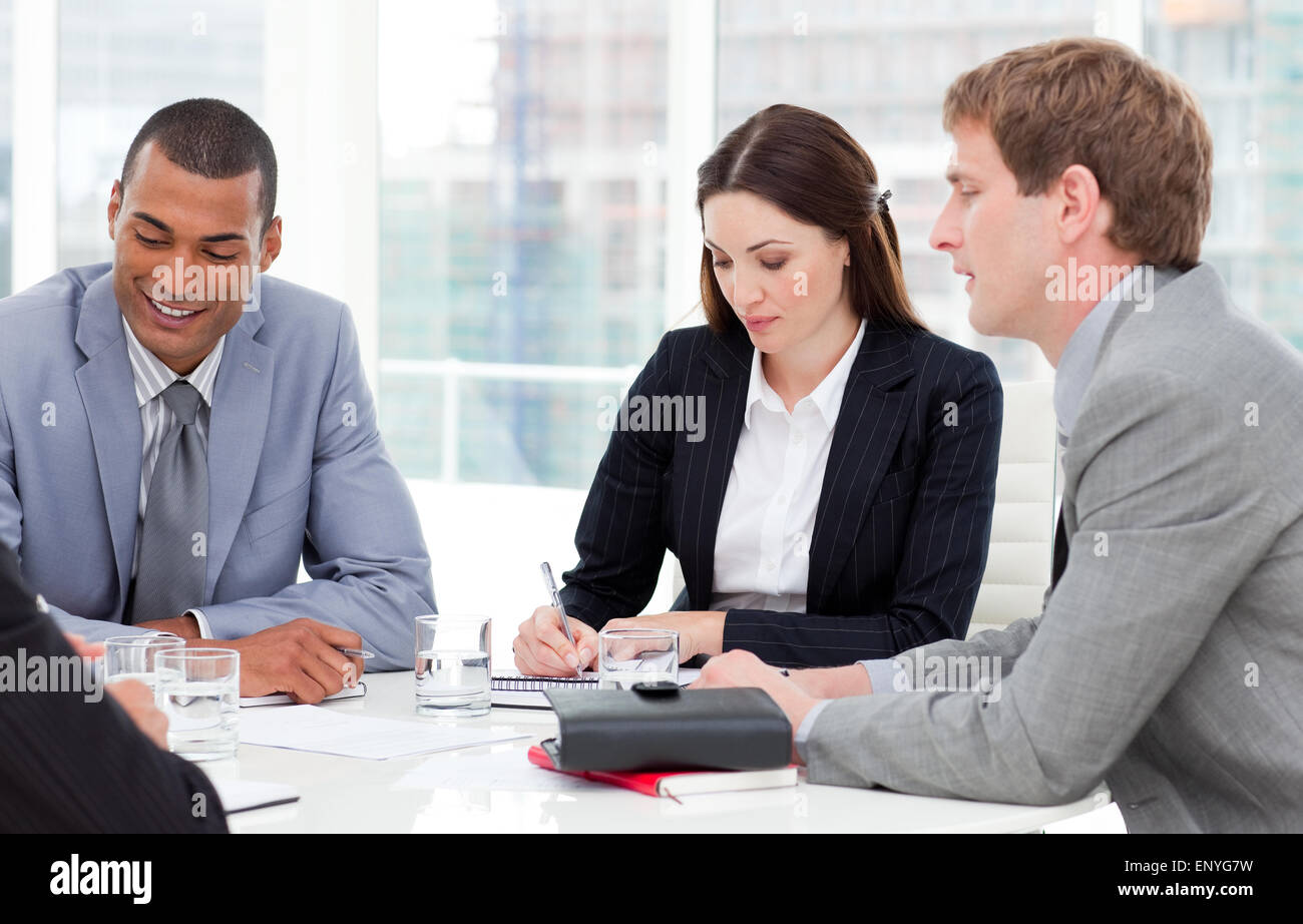 Concentrated business group having a meeting Stock Photo - Alamy
