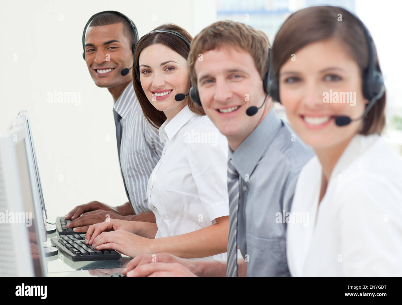 Customer service agents with headset on Stock Photo - Alamy