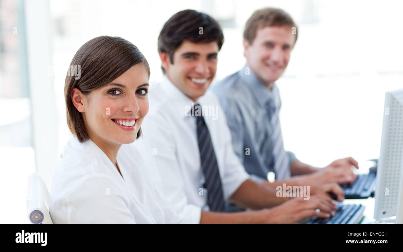 Enthusiastic business people working at computers Stock Photo - Alamy