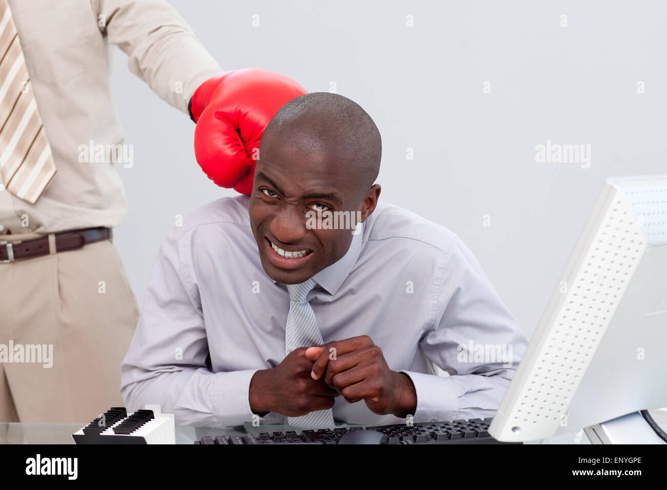 Afro-American businessman being boxed Stock Photo - Alamy