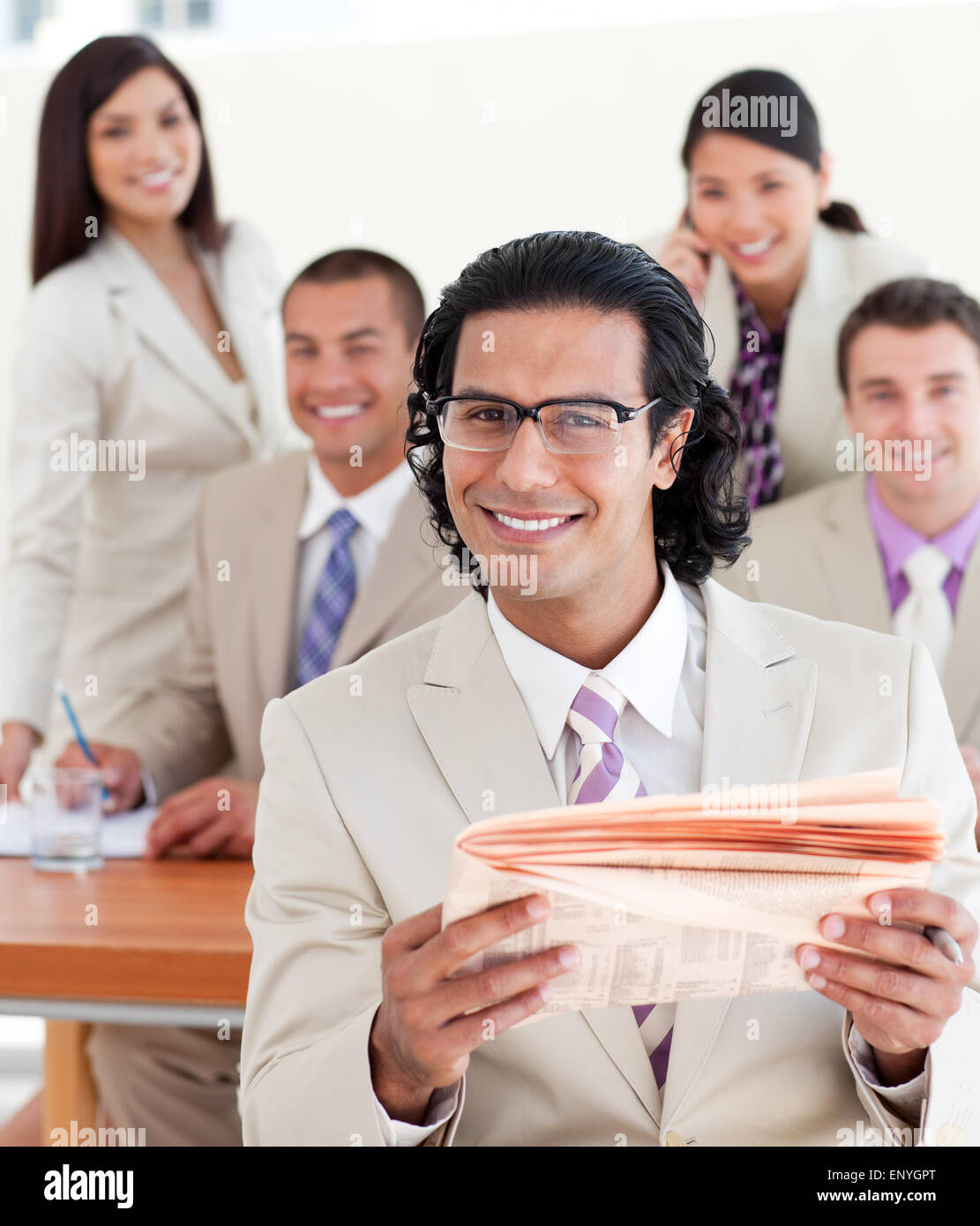 Cheerful manager reading a newspaper Stock Photo - Alamy