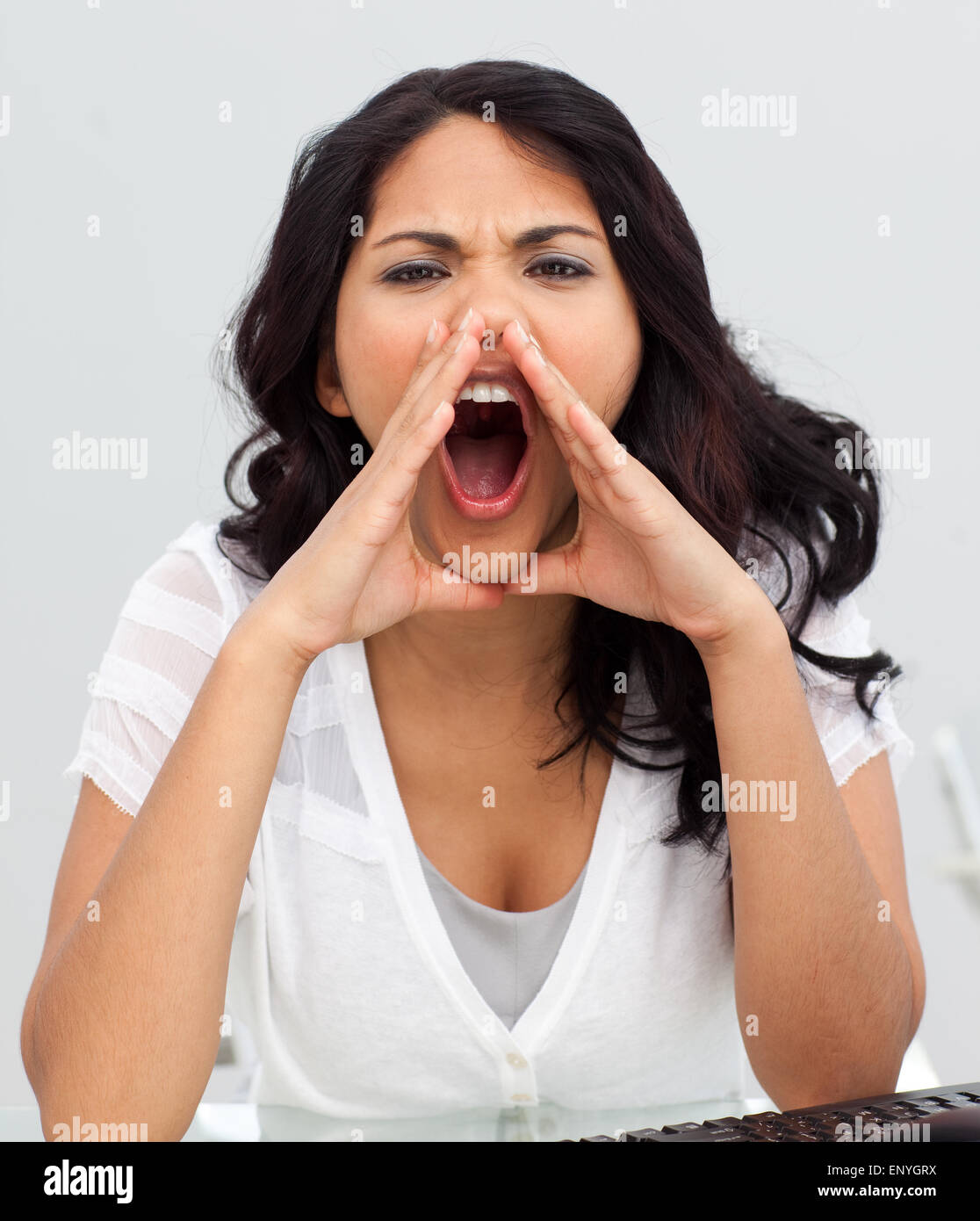 Businesswoman yelling in the office Stock Photo - Alamy