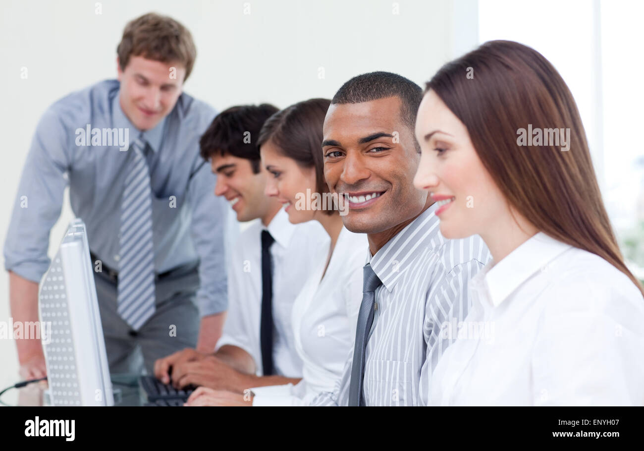 Enthusiastic business team working at computer Stock Photo - Alamy