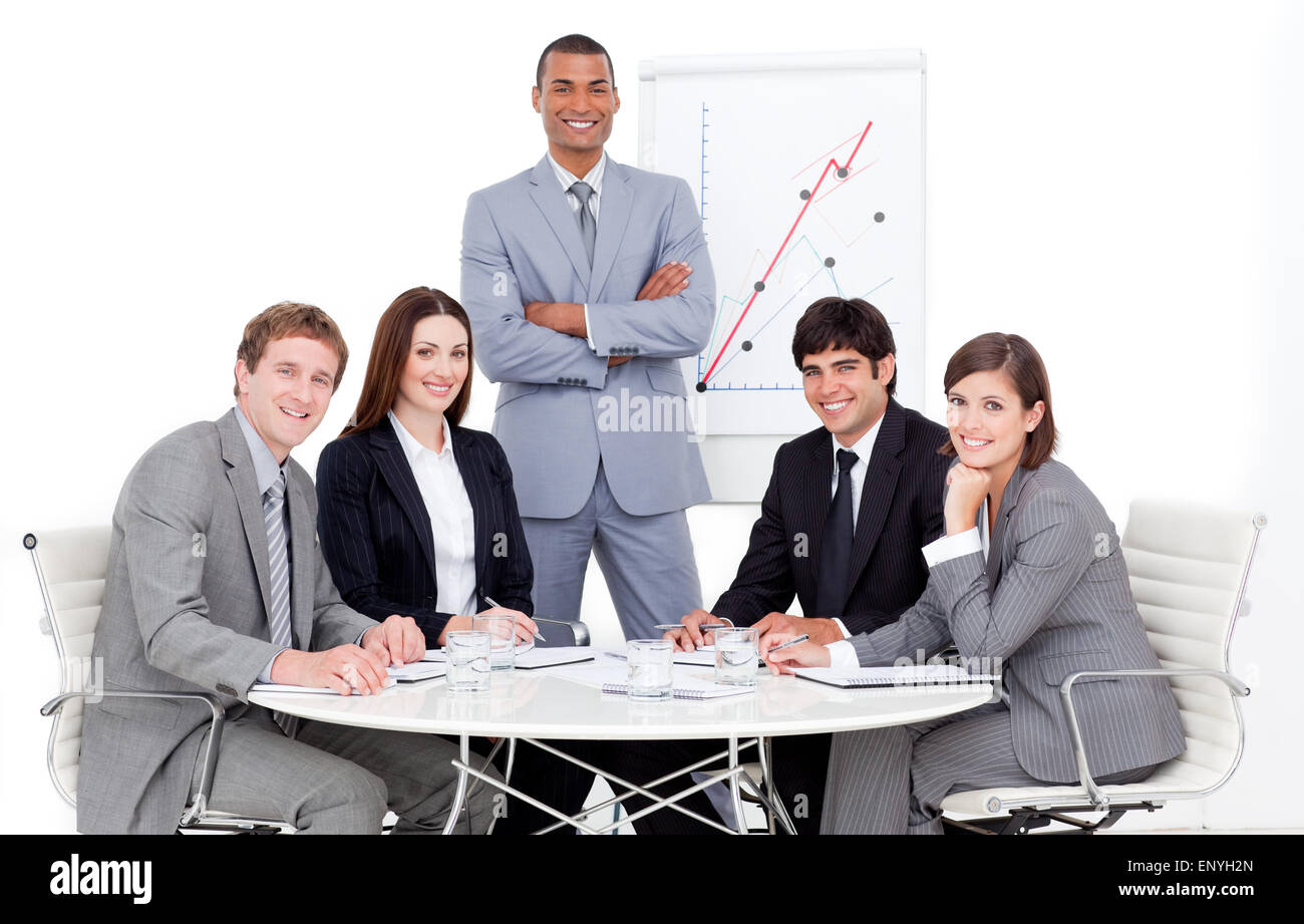 Charming manager giving a presentation to his colleagues Stock Photo ...