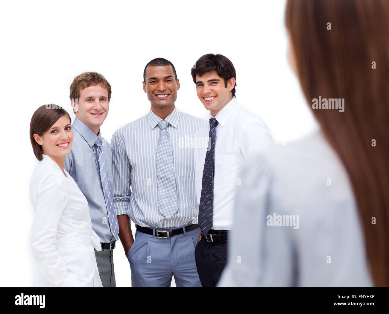 Businesswoman looking back at her smiling team Stock Photo - Alamy