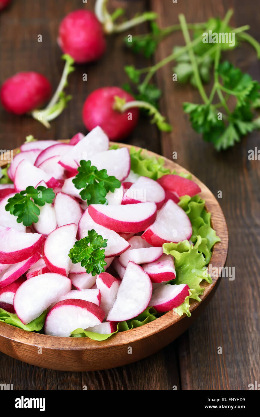 Fresh radish salad on wooden table Stock Photo - Alamy