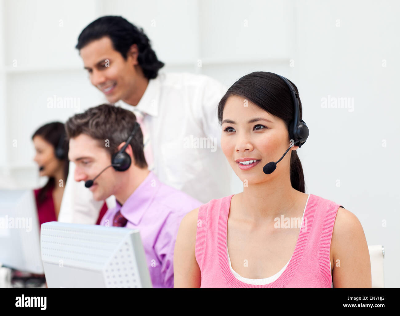 Presentation of an Asian customer agent and her team Stock Photo - Alamy
