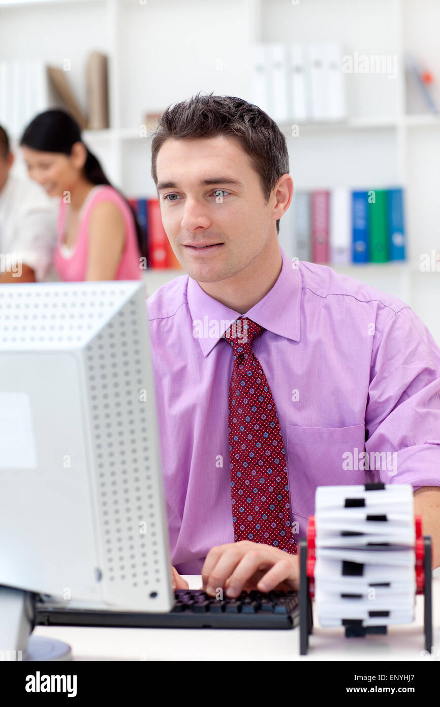 Confident businessman working at his computer Stock Photo - Alamy