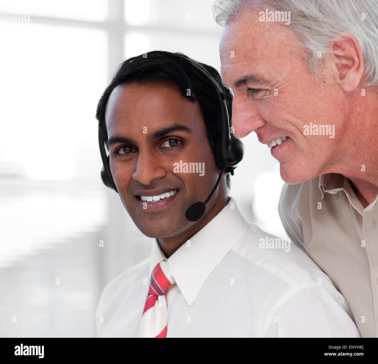 Multi-ethnic customer service agents working together Stock Photo - Alamy