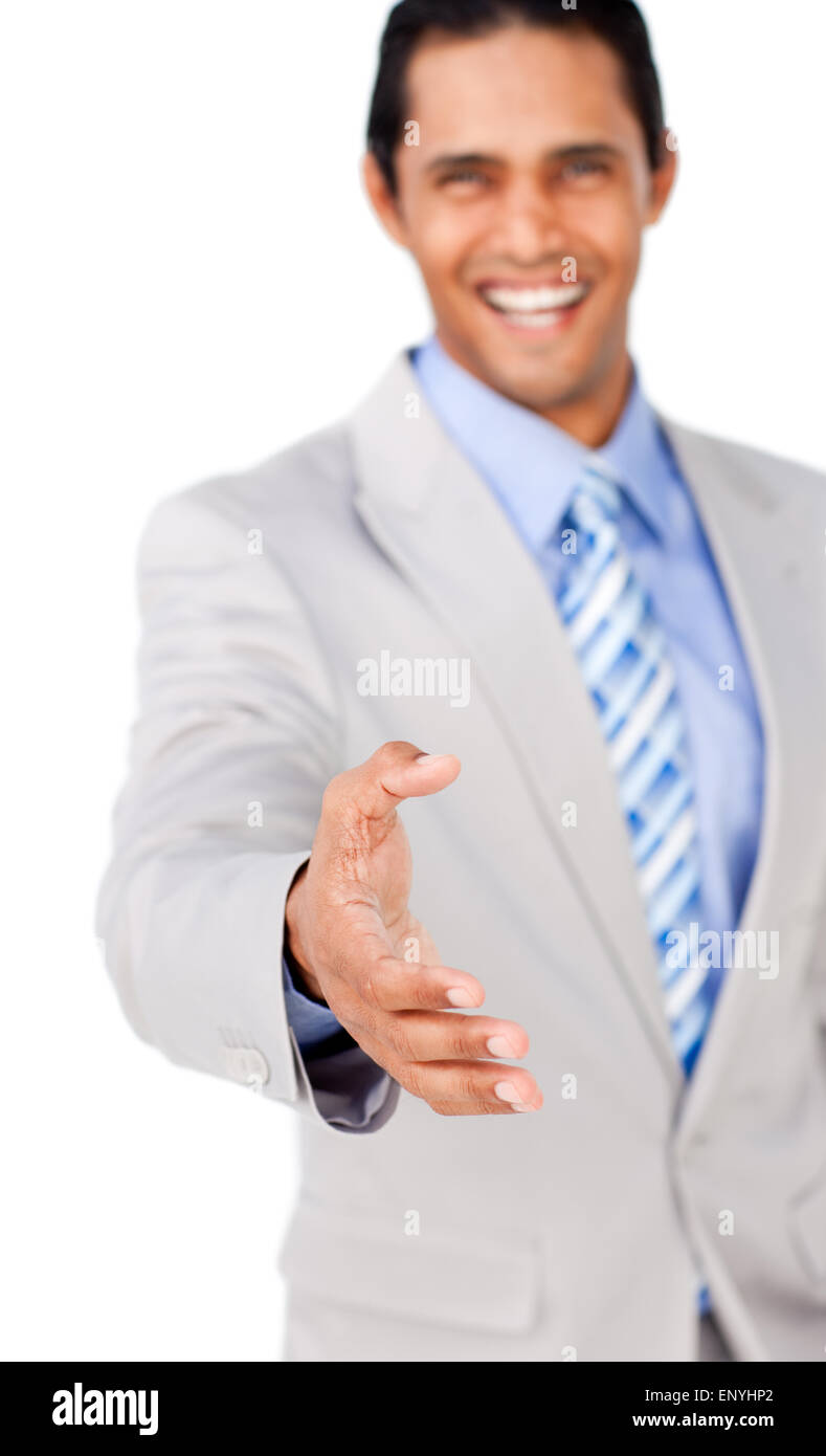 Confident businessman reaching out to shake hands Stock Photo - Alamy