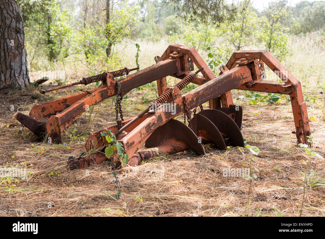 old big metal plow in dry grass in portugal Stock Photo - Alamy