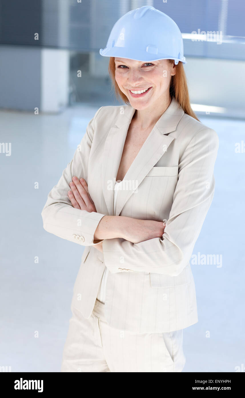 Attractive female architect wearing a hard hat Stock Photo - Alamy