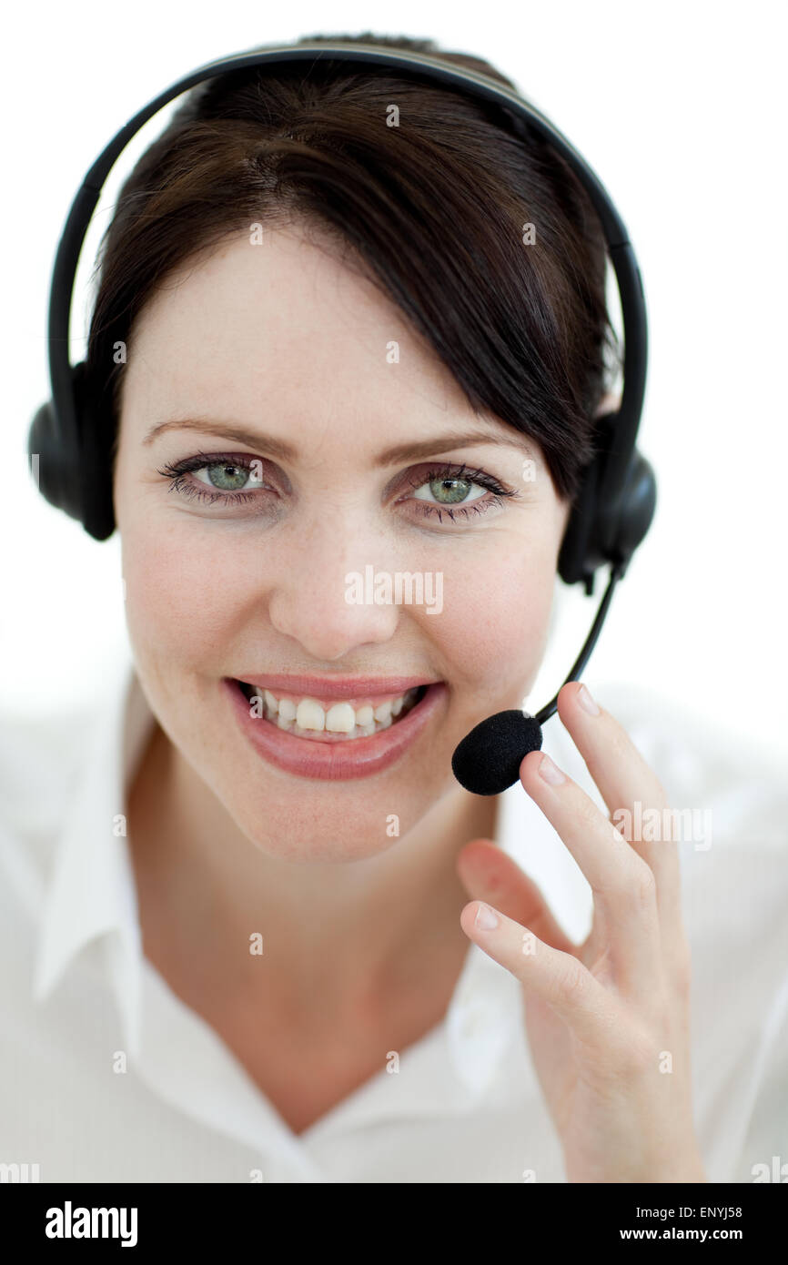 Smiling customer service agent with headset on against a white ...