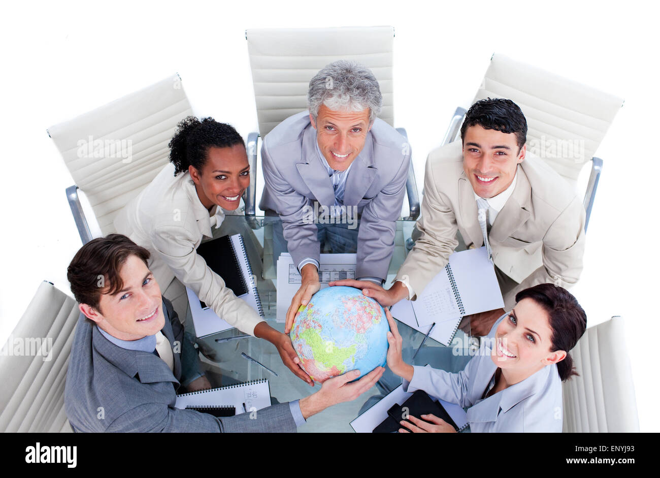 High angle of positive business people holding a terrestrial globe in a ...