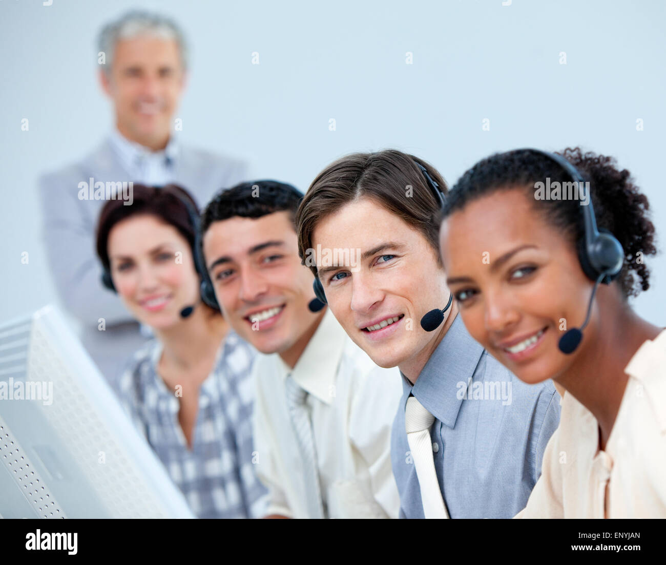Cheerful business team working in a call center Stock Photo - Alamy