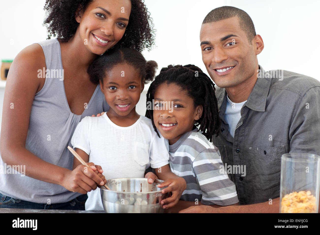 Cheerful family making cookies together Stock Photo - Alamy