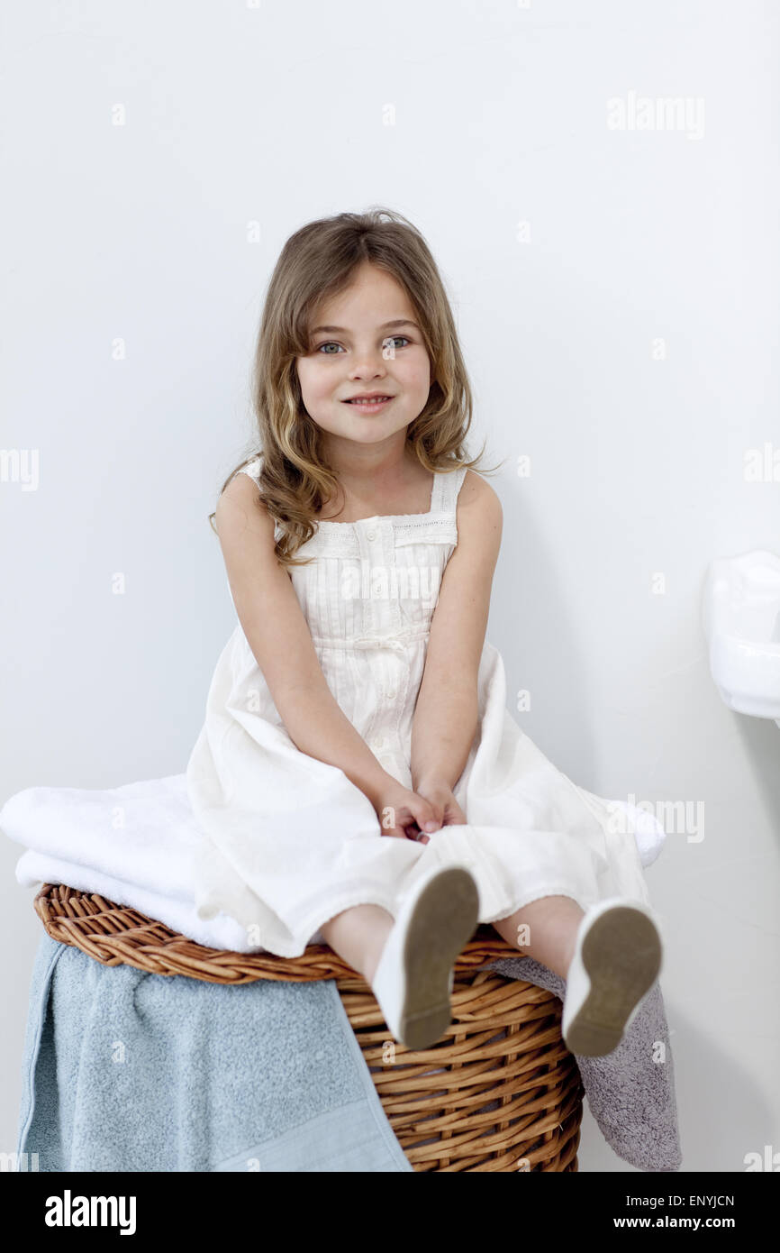 Little Girl Sitting In Bathroom Stock Photo Alamy