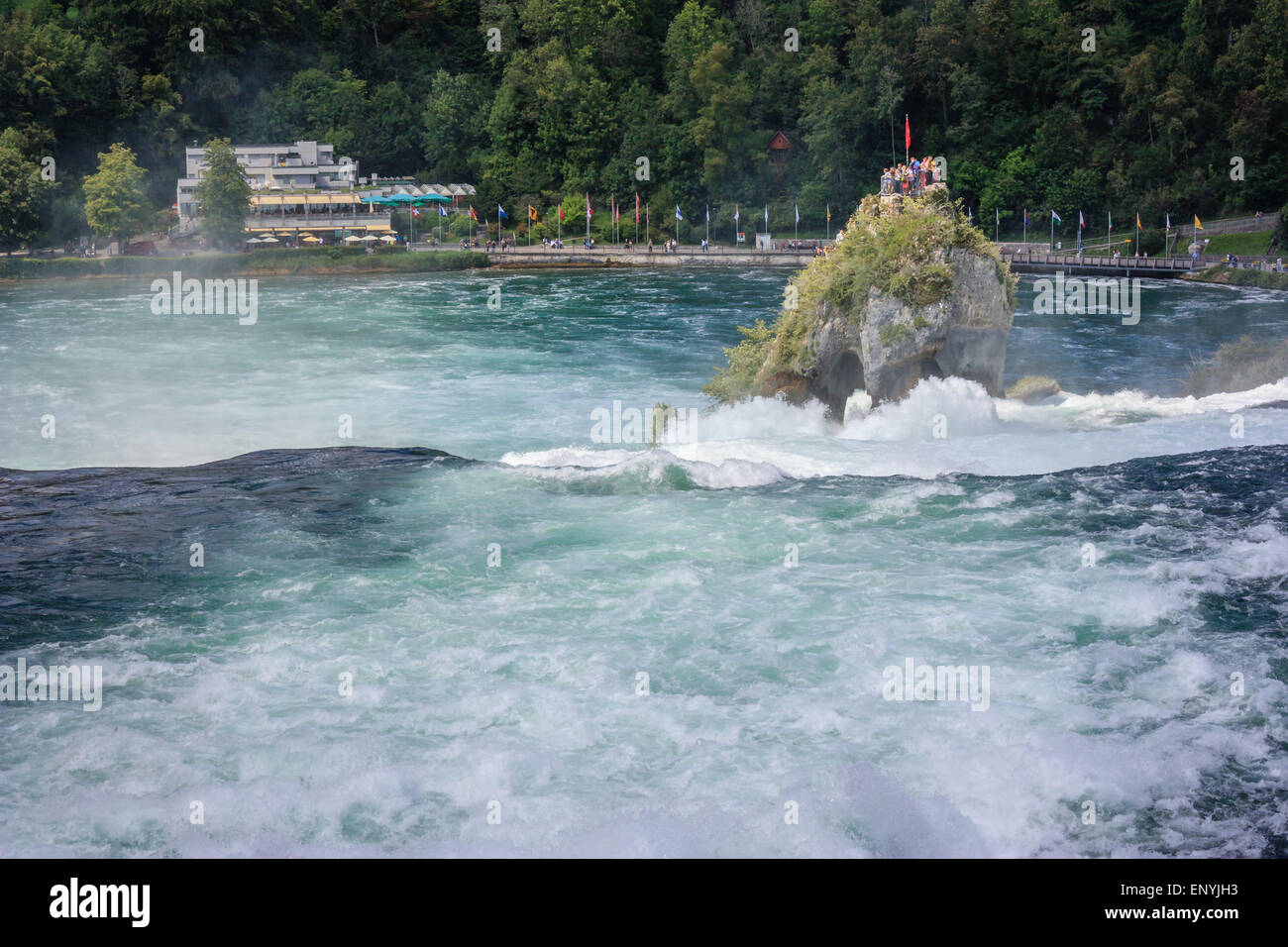 Group of tourists experiencing the natural splendor from atop a rocky ...