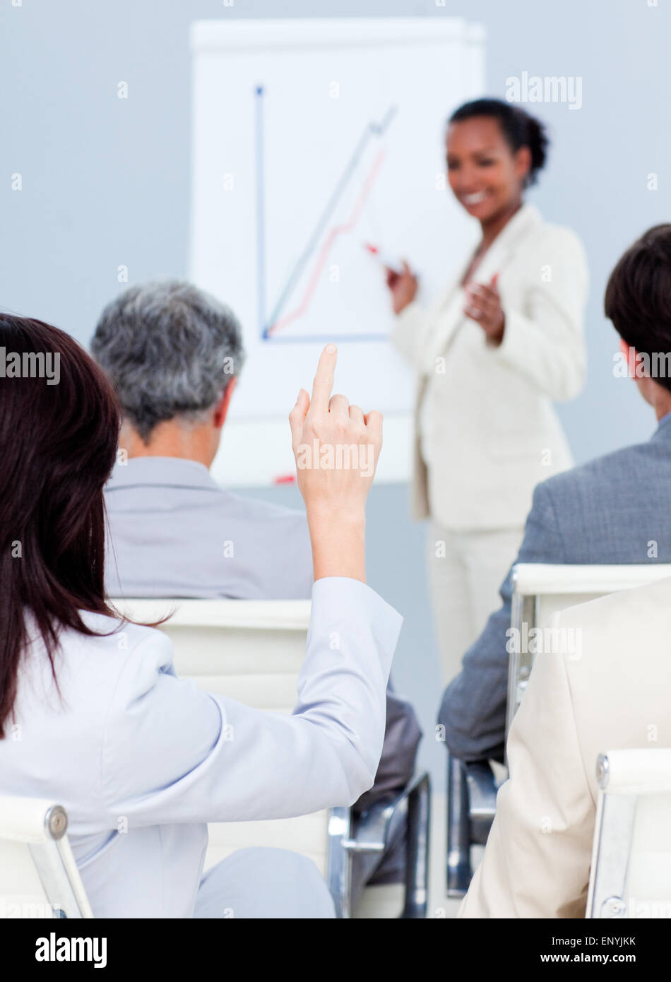 Young businesswoman asking a question at a conference Stock Photo - Alamy