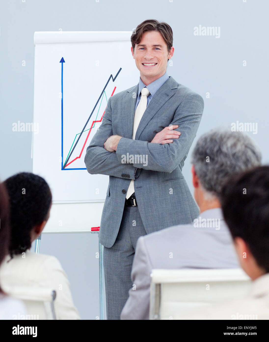 Confident businessman reporting sales figures Stock Photo - Alamy