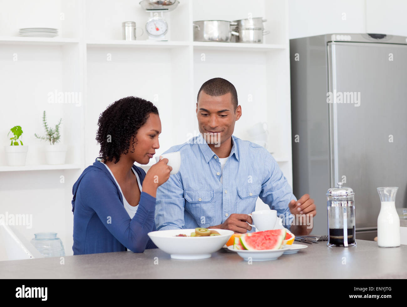 Smiling couple having breakfast together Stock Photo - Alamy