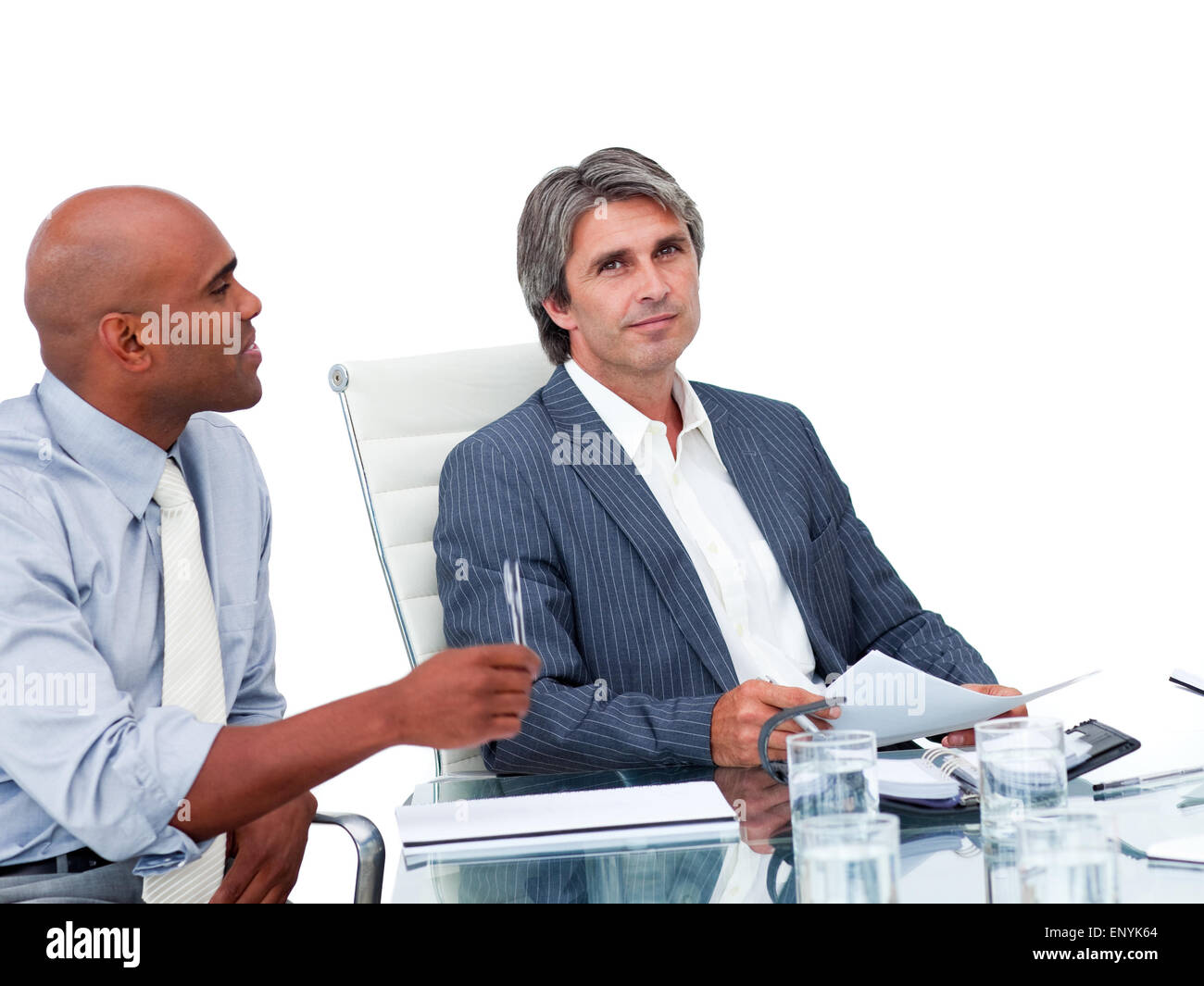 Two handsome businessmen having a meeting against a white background ...